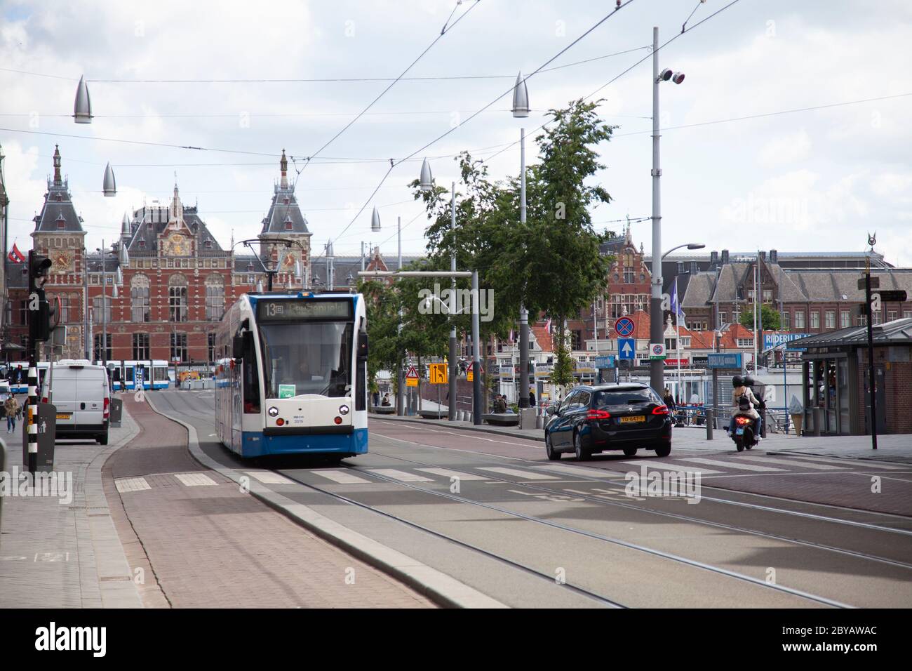 Tram crossing the city of Amsterdam Stock Photo - Alamy
