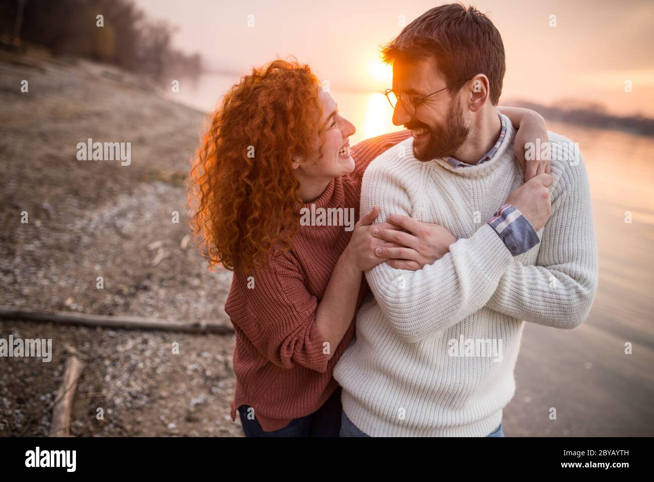 Portrait of beautiful young couple enjoying nature Stock Photo - Alamy