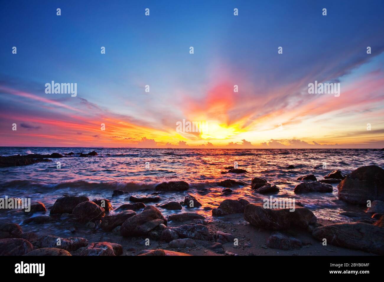 Tropical beach at sunset Stock Photo - Alamy