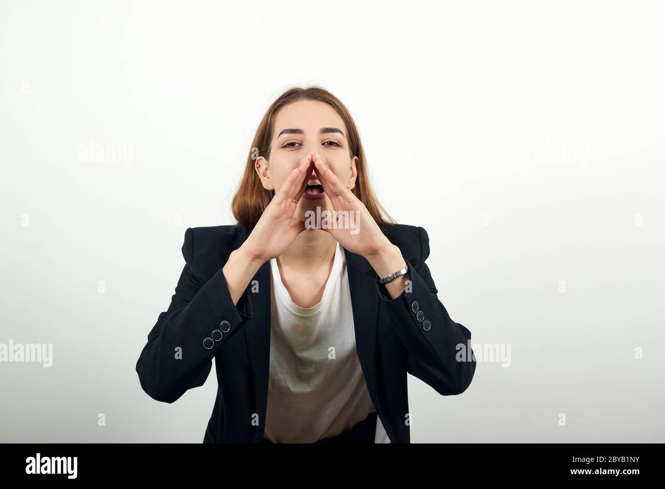 Scream and shout Holding hands near opened mouth. Screaming loudly with ...