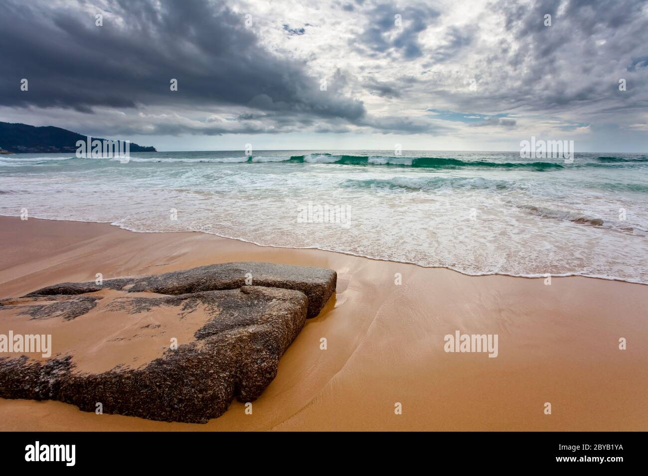 tropical beach under gloomy sky Stock Photo - Alamy