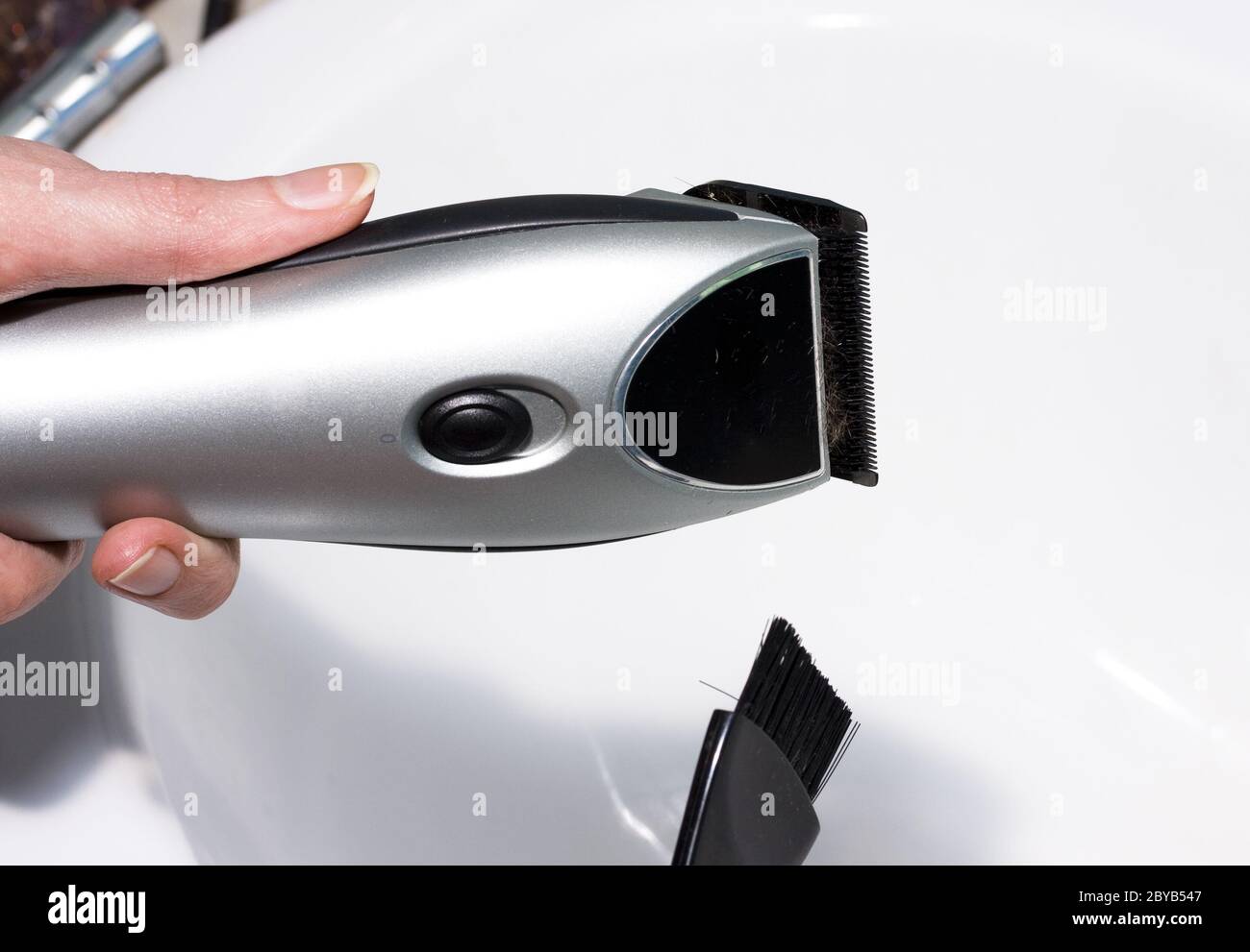 Cleaning of hairclipper Stock Photo - Alamy