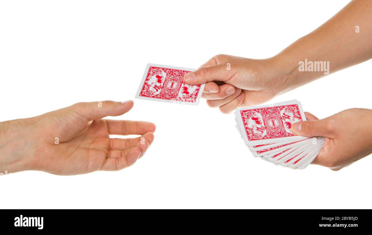 Woman giving playing card Stock Photo - Alamy