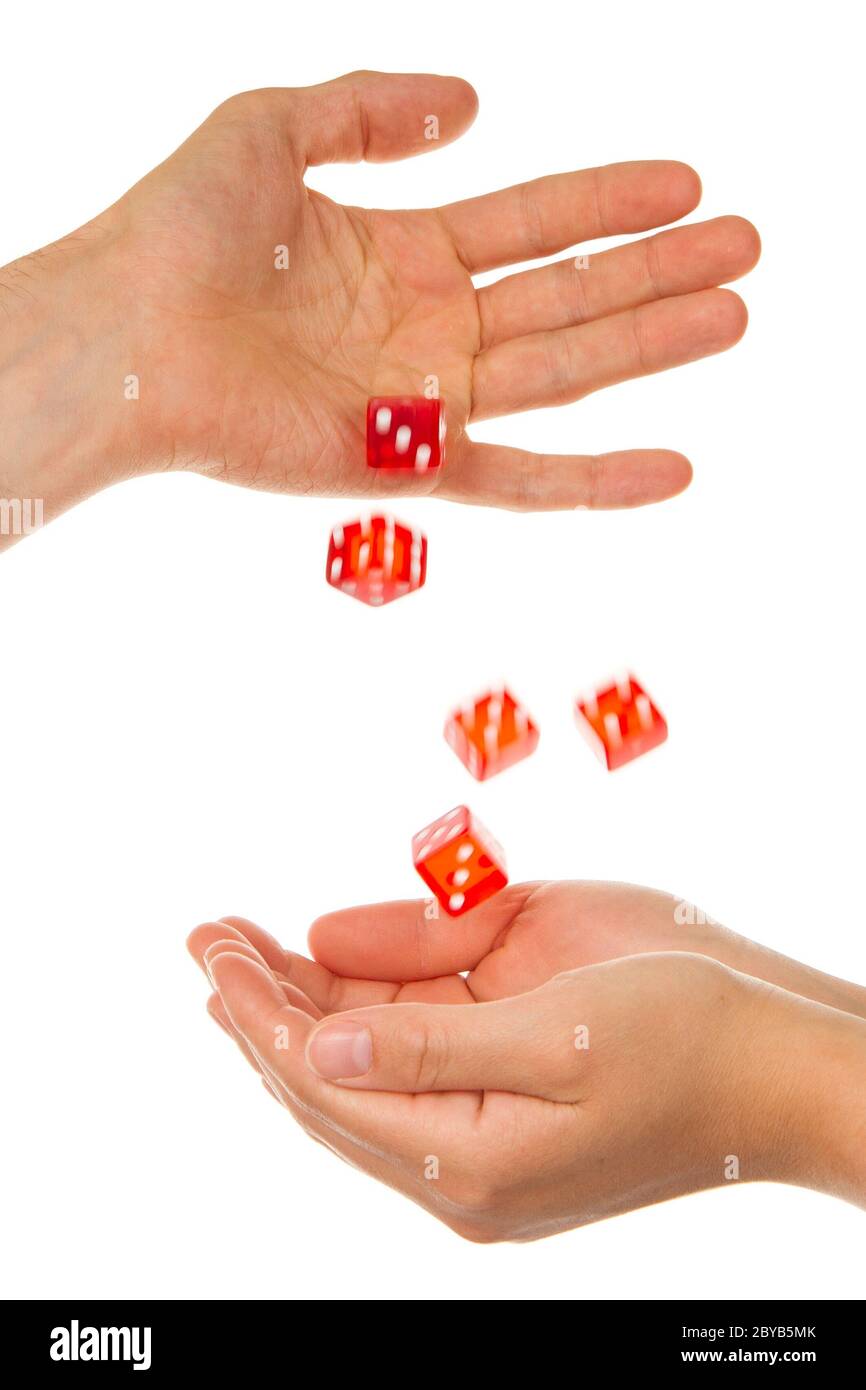 Five red dice being thrown from a hand Stock Photo - Alamy