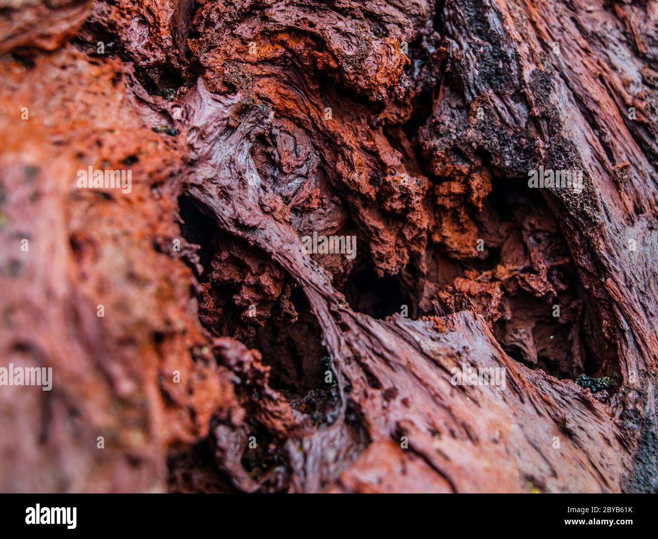 Texture of red volcanic stone made after solidification of lava ...