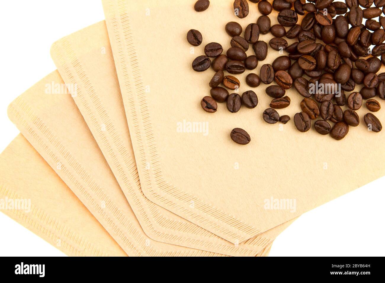 Coffee beans on a coffee filter (white background Stock Photo - Alamy