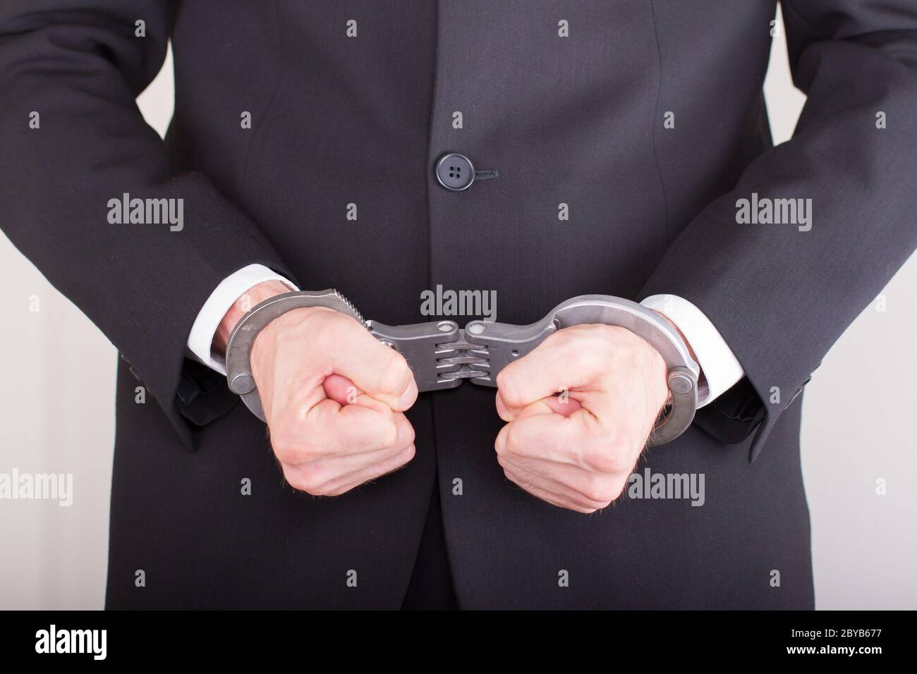 Man suit handcuffs hi-res stock photography and images - Alamy