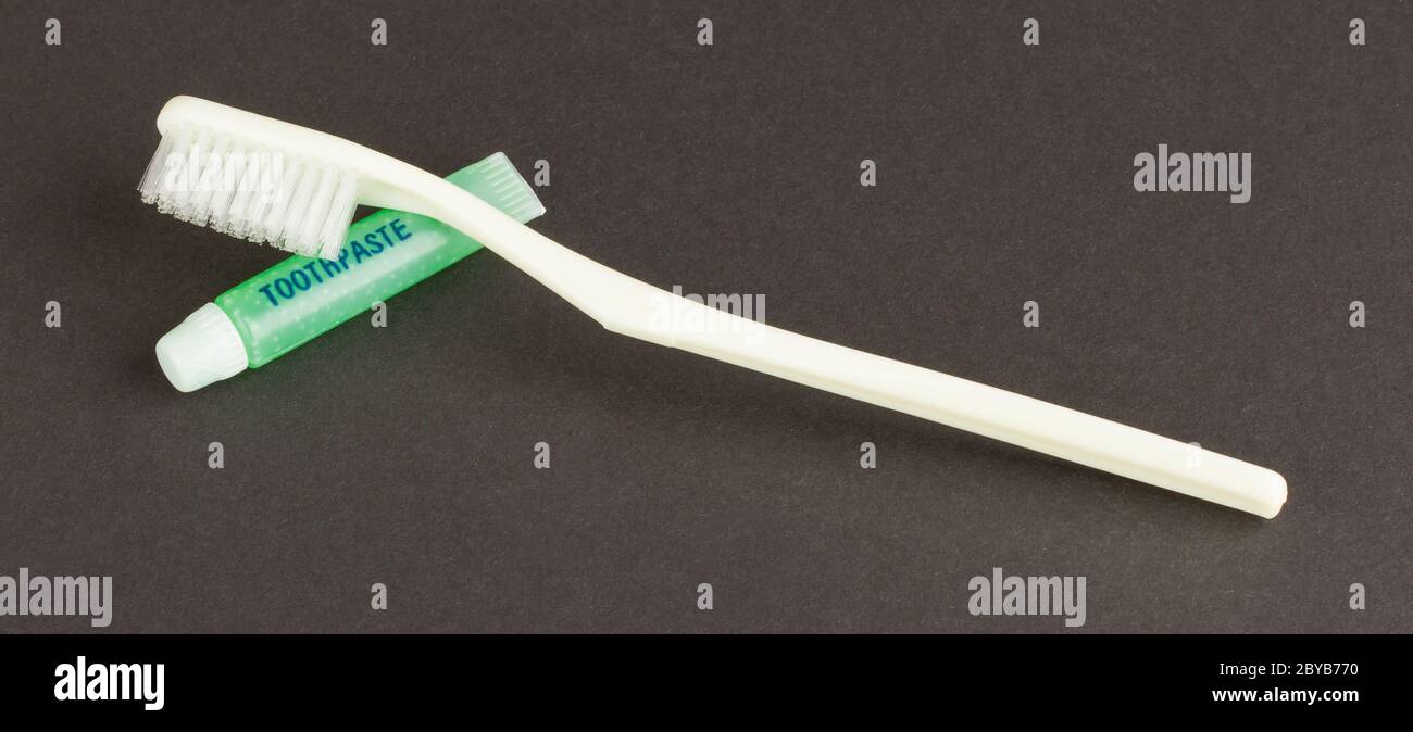Toothbrush and green toothpaste isolated Stock Photo - Alamy