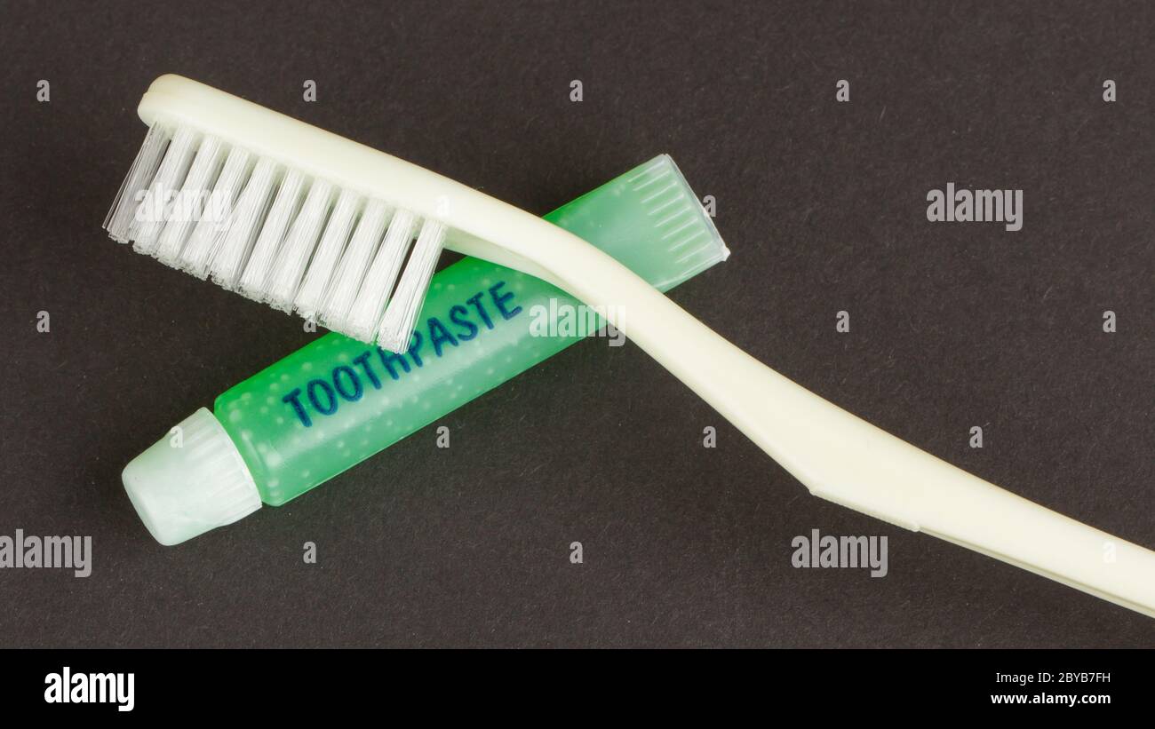Toothbrush and green toothpaste isolated Stock Photo - Alamy