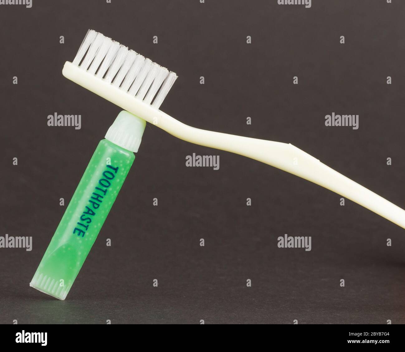 Toothbrush and green toothpaste isolated Stock Photo - Alamy