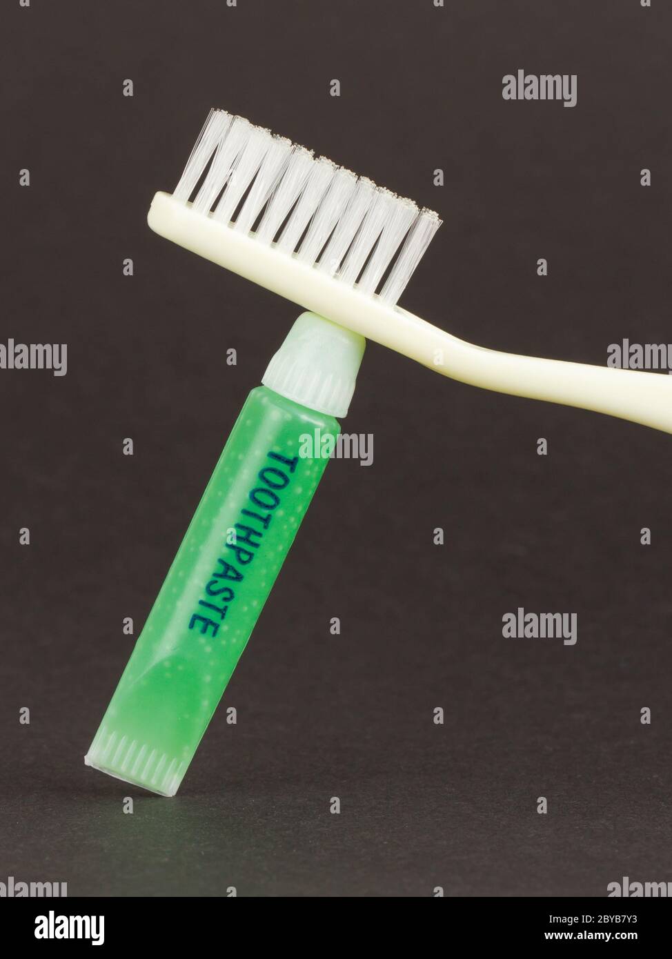 Toothbrush and green toothpaste isolated Stock Photo - Alamy