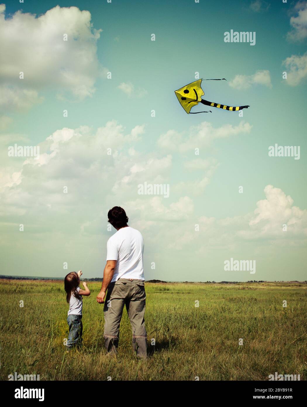 Little girl father flying kite hi-res stock photography and images - Alamy