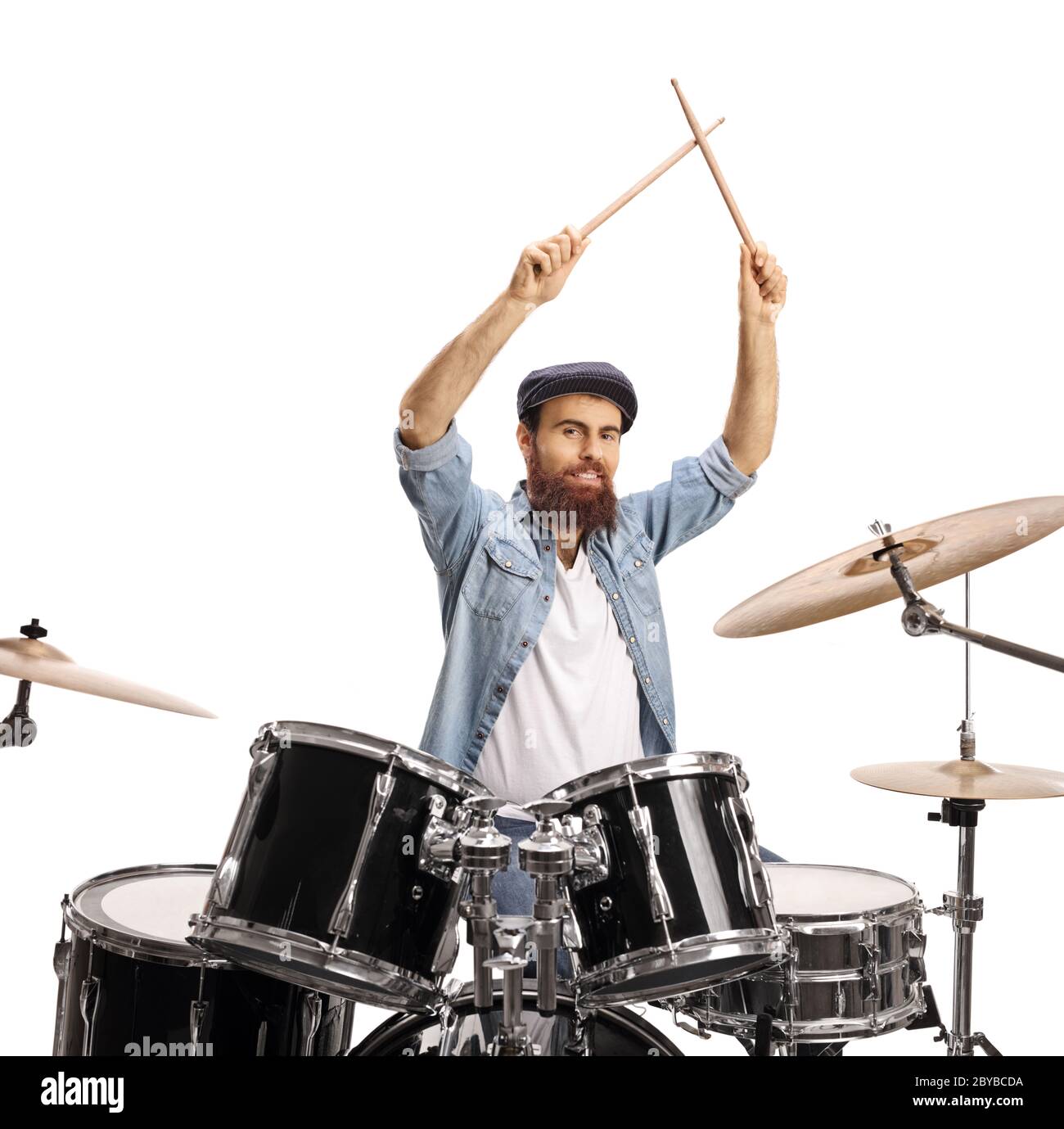 Bearded guy with drumsticks starting to play drums isolated on white ...