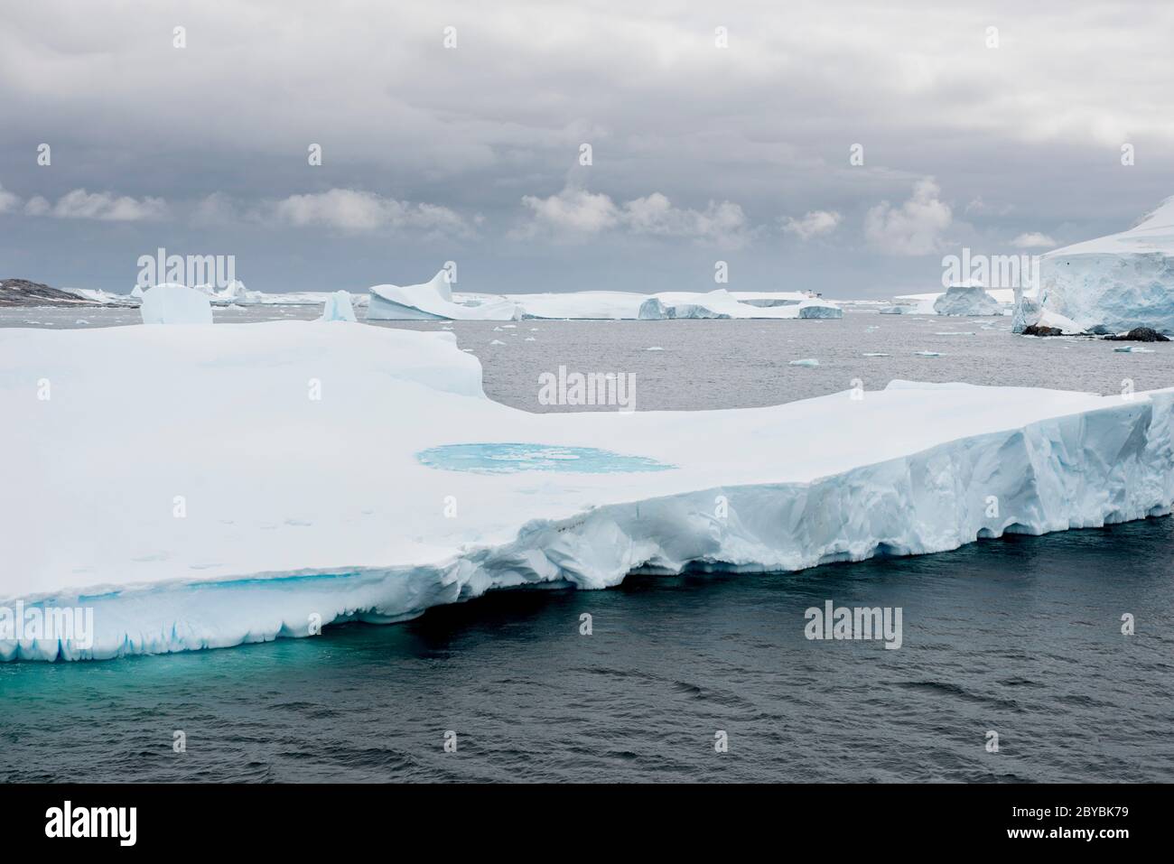 pool of water forming on an iceberg at Port Charcot Antarctica Stock ...