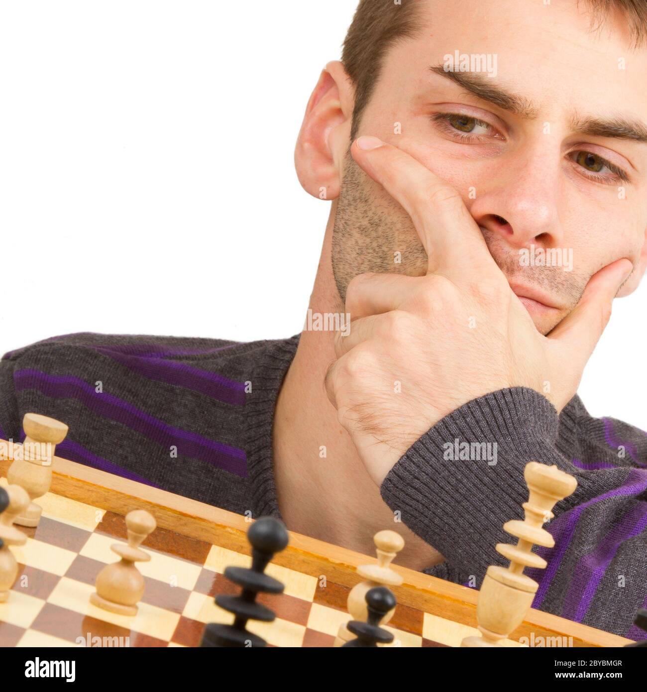 Chessboard with desperate man thinking about chess strategy, isolated ...