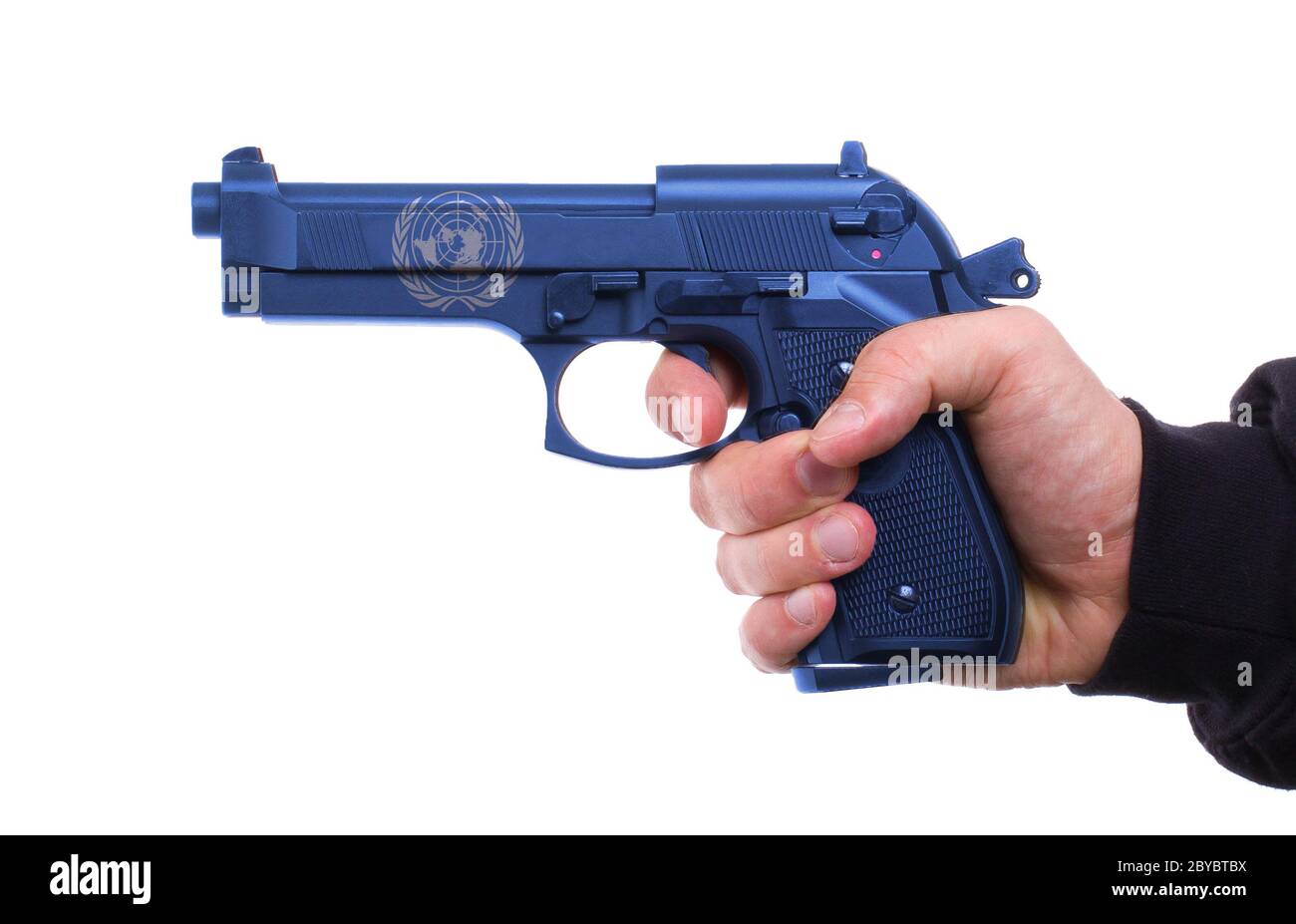 Pistol in hand Stock Photo - Alamy