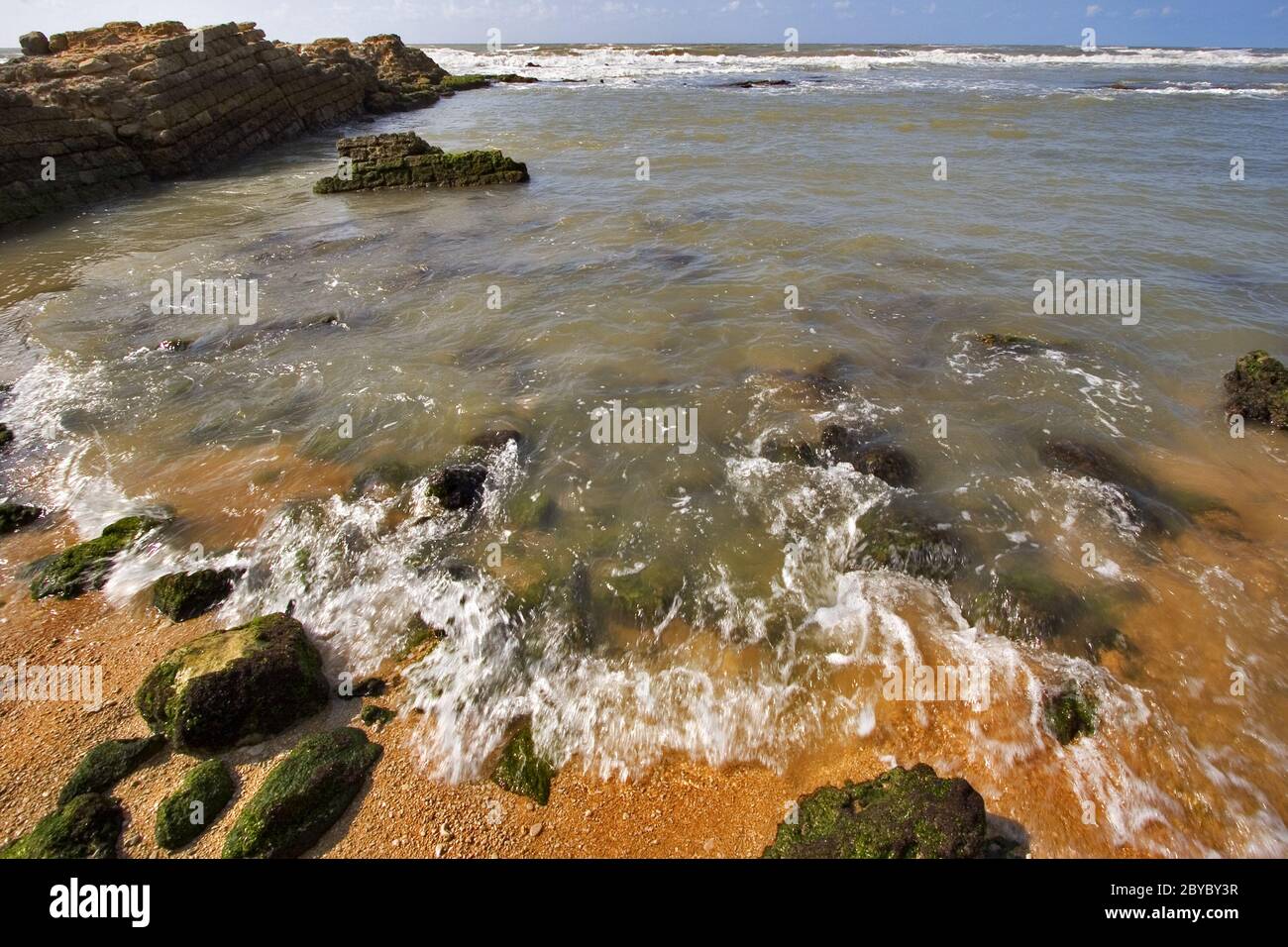 Stone ledge in the sea Stock Photo - Alamy