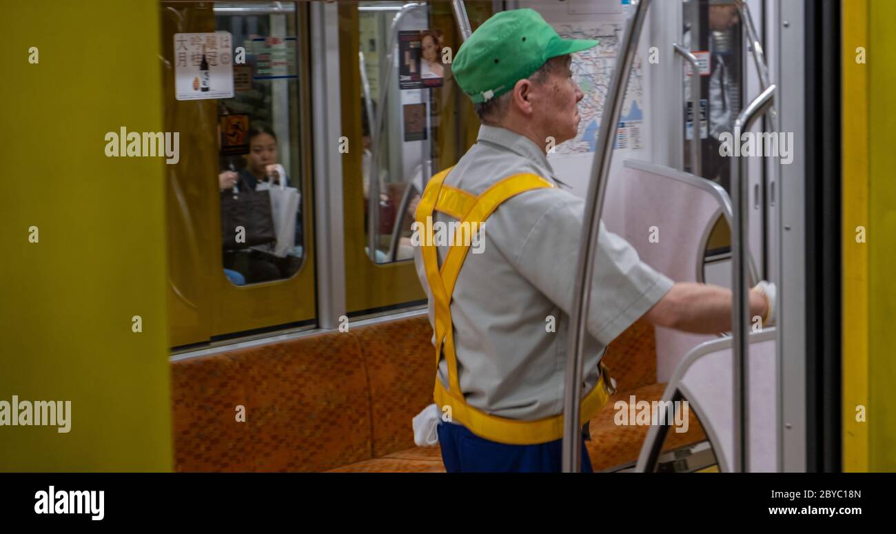 Cleaner workers cleaning Tokyo Metro subway train Stock Photo - Alamy