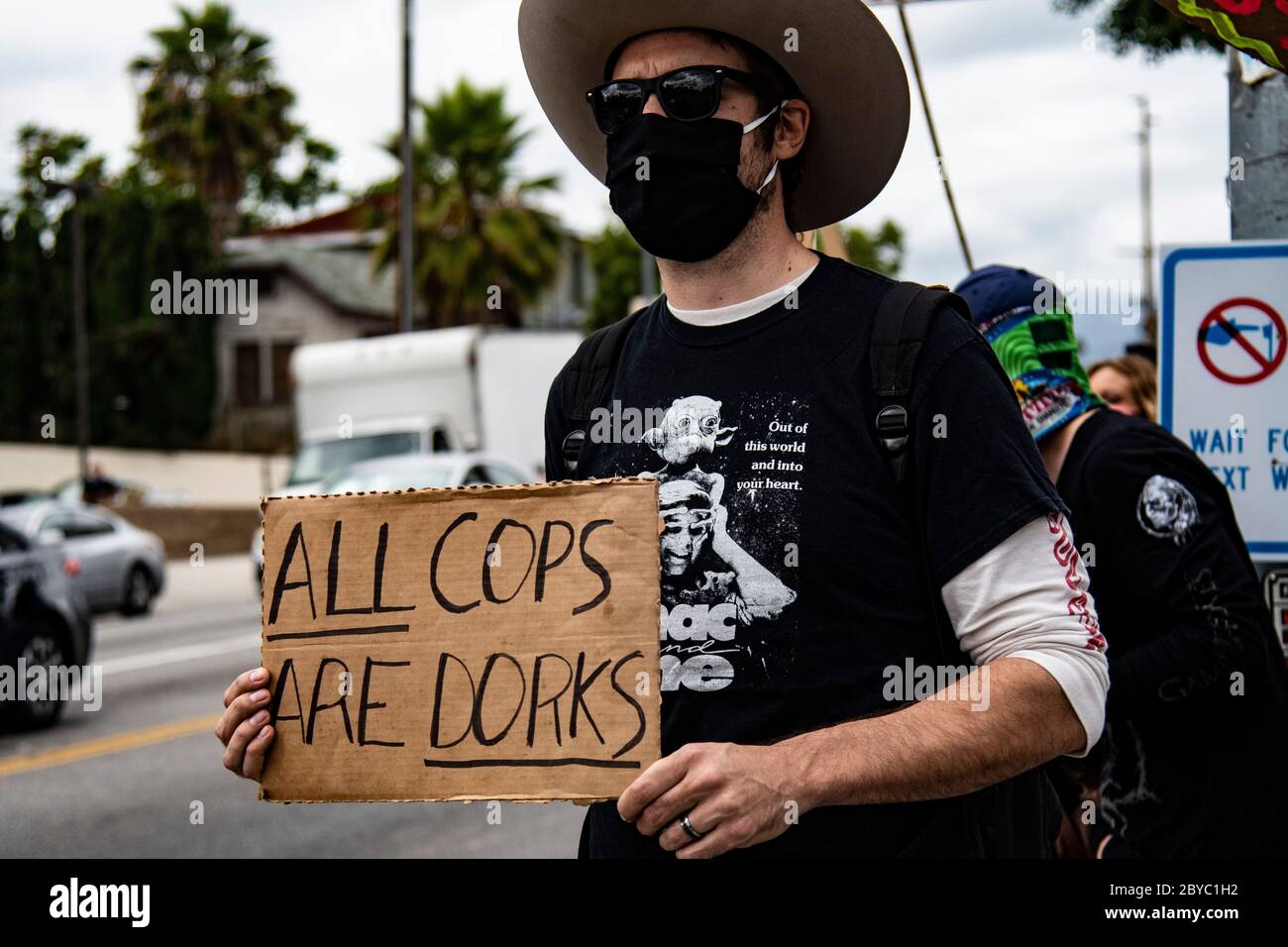 Protestors carry signs during peaceful protest in Los Angeles honoring ...