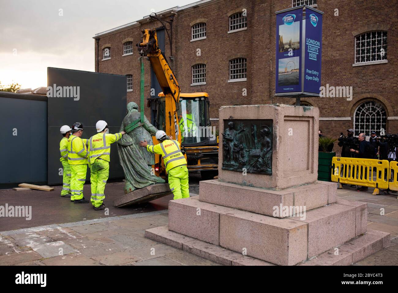 The statue of Robert Milligan is lifted from its plinth using a JCB in ...
