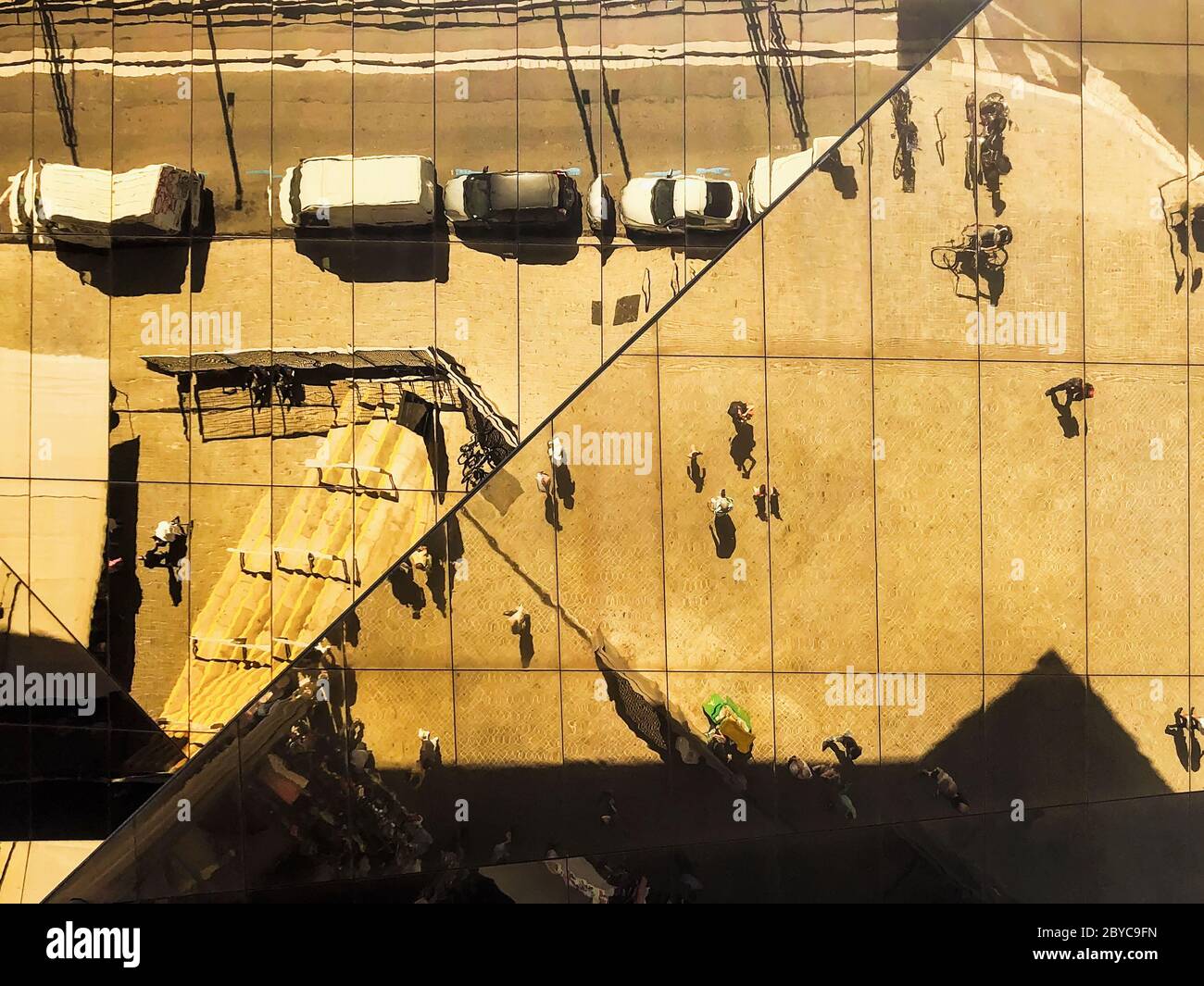 Sunny day in the city. Reflections and distorted images with ...