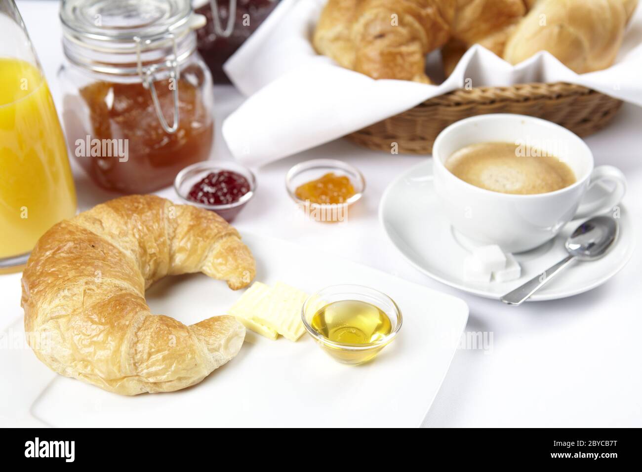 breakfast table with croissant, spread and coffee Stock Photo - Alamy