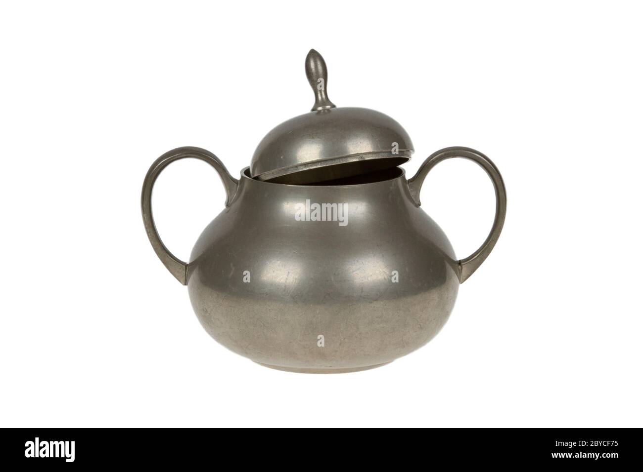 Very old tin sugar pot full of scratches Stock Photo - Alamy