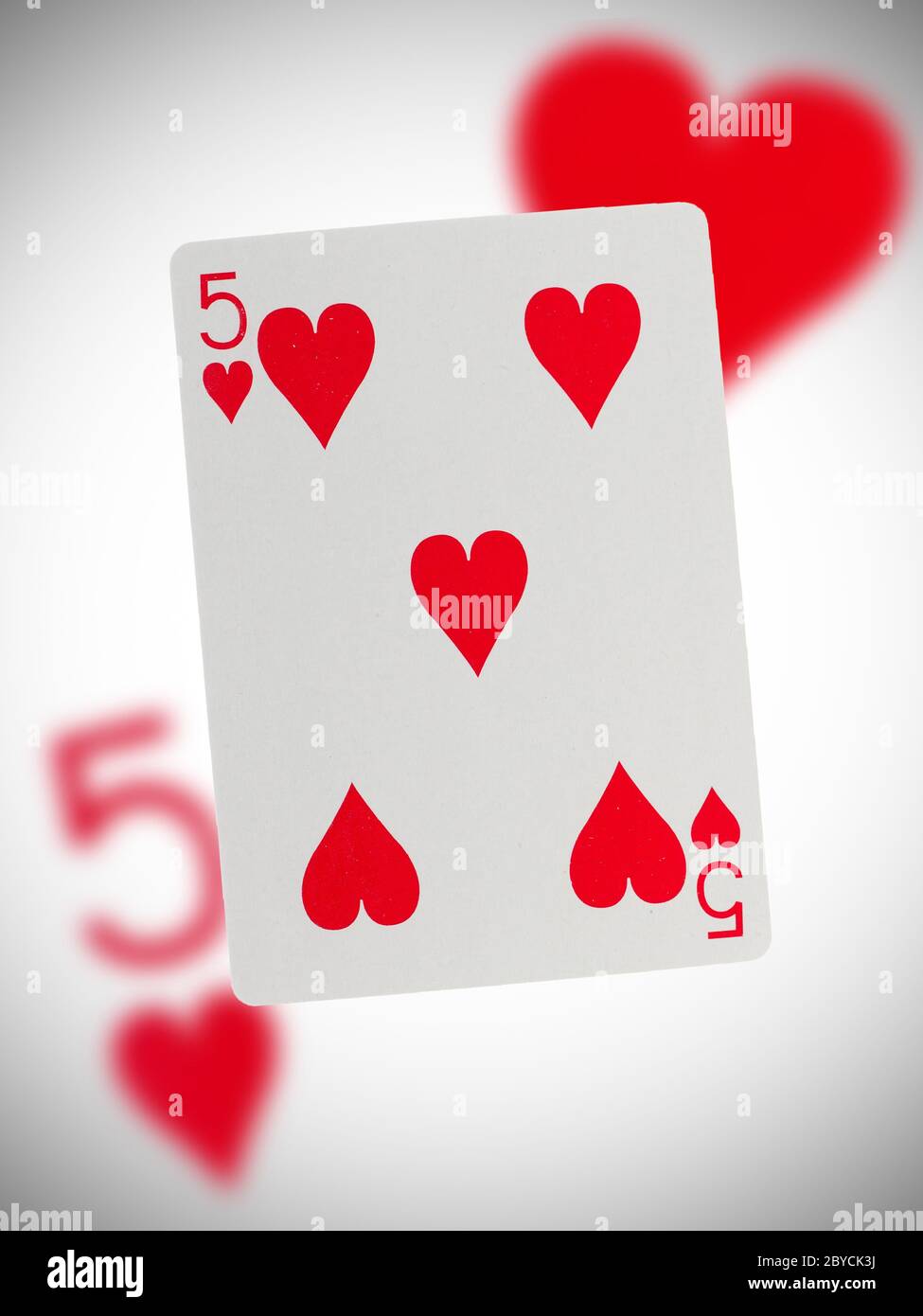 Playing card, five of hearts Stock Photo - Alamy