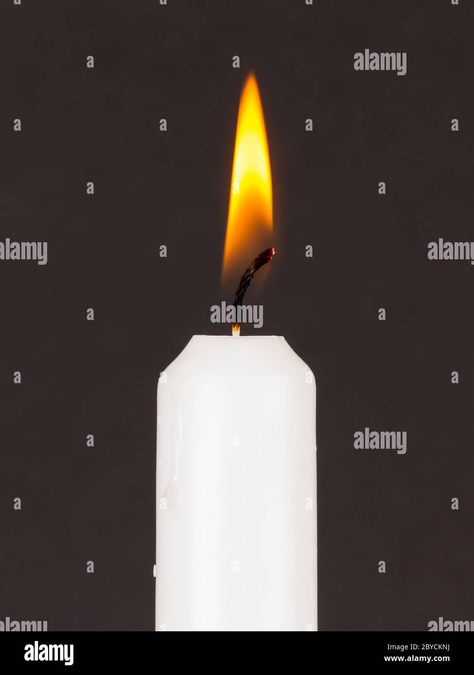 White candle isolated Stock Photo - Alamy