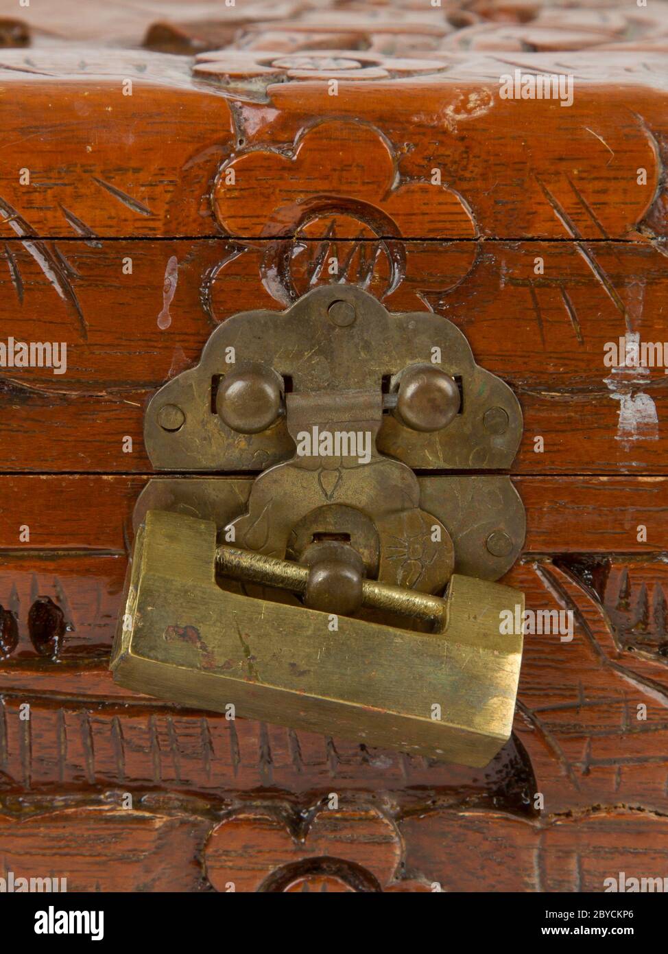 Old padlock on a wooden chest made in Suriname Stock Photo - Alamy