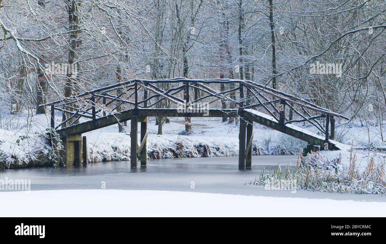 Wooden bridge covered in snow Stock Photo - Alamy