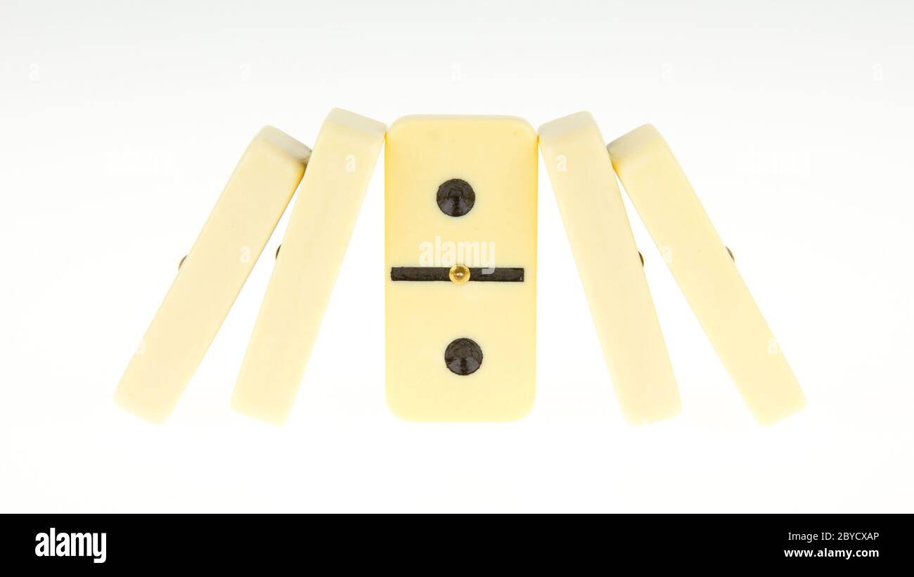 Falling dominoes isolated Stock Photo - Alamy