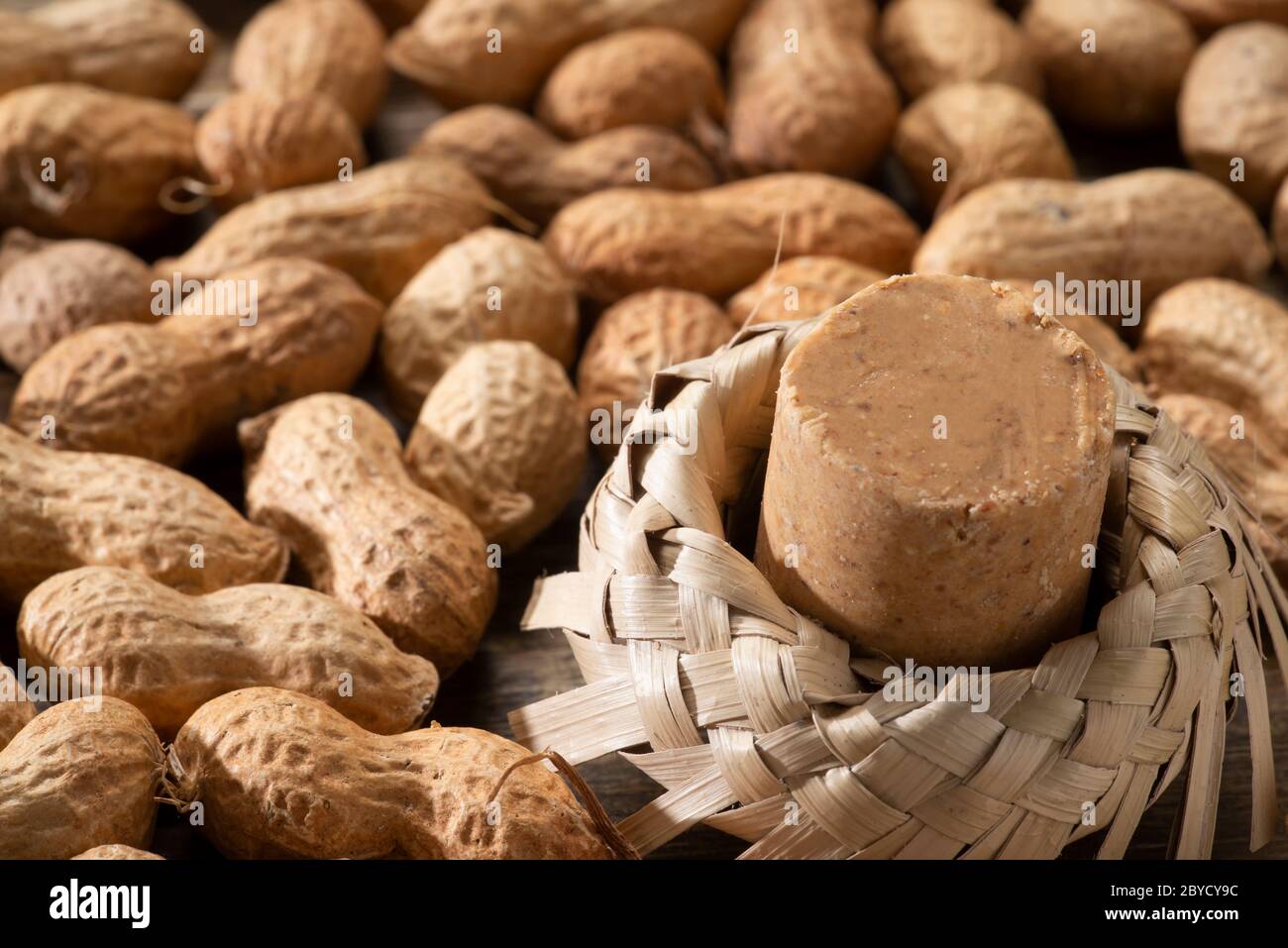 pressed peanut candy in a cylinder shape, inside a miniature hat ...