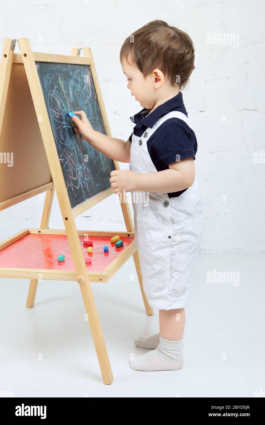 Child Drawing With Chalk Stock Photo - Alamy