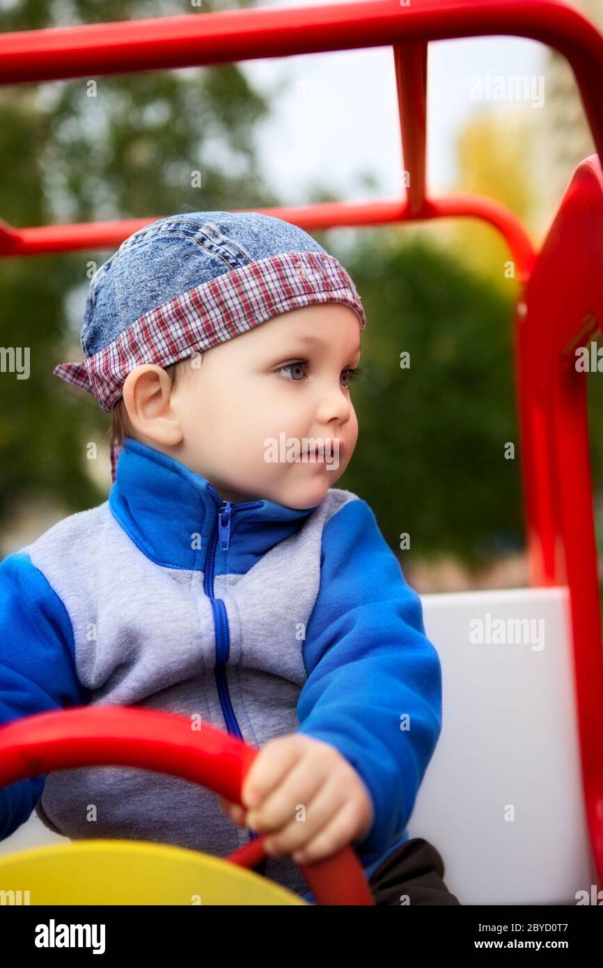 Boy playing at playground hi-res stock photography and images - Alamy
