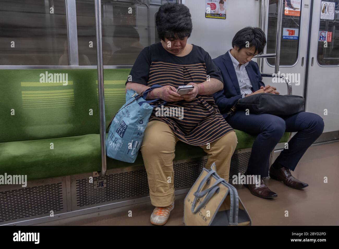 Passengers commuting in commuter train, Tokyo, Japan Stock Photo - Alamy