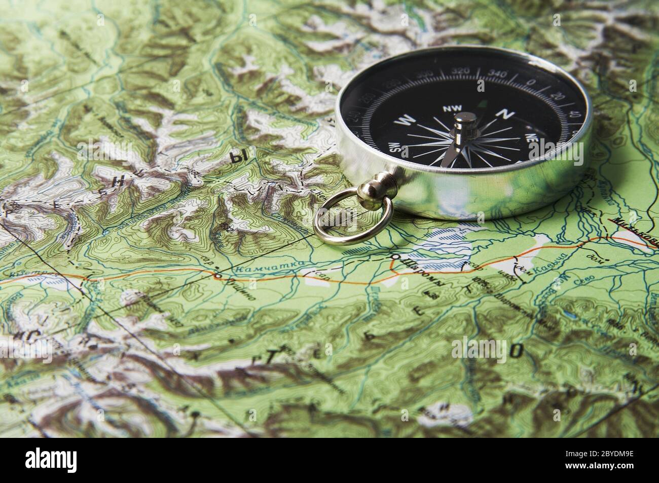 Compass and map Stock Photo - Alamy