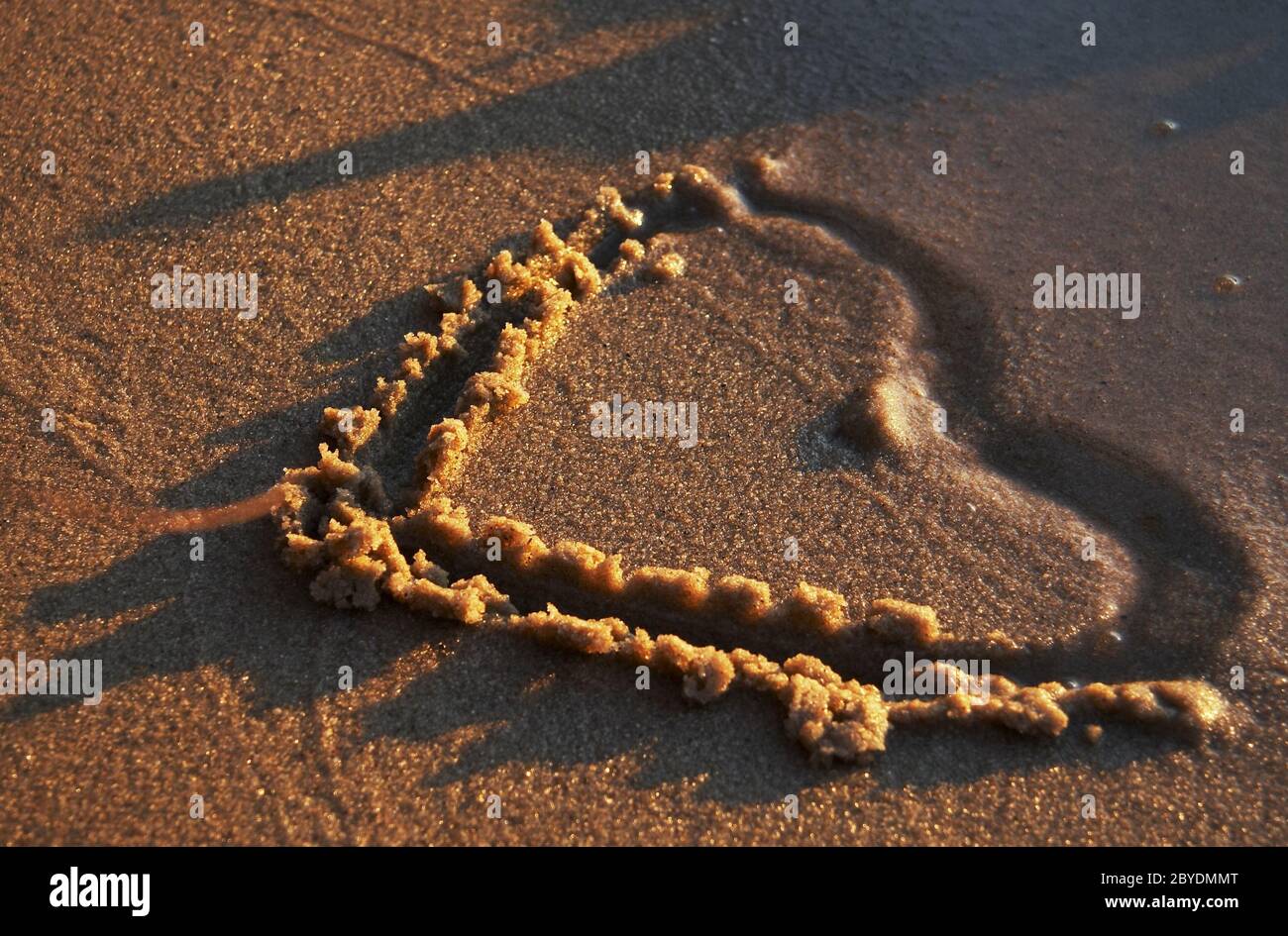 Friendship in the sand hi-res stock photography and images - Alamy