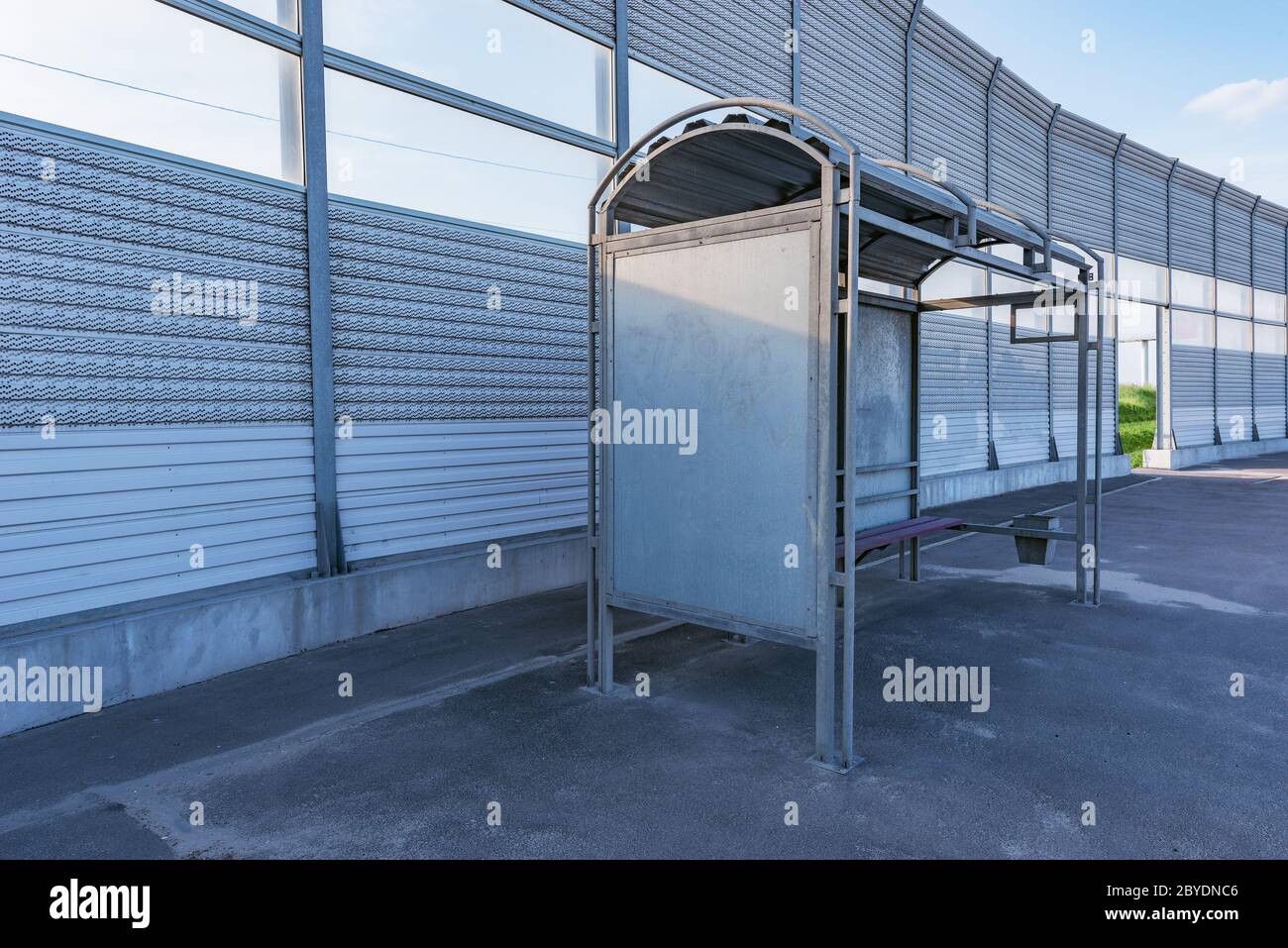 Empty metal bus stop by the highway Stock Photo - Alamy