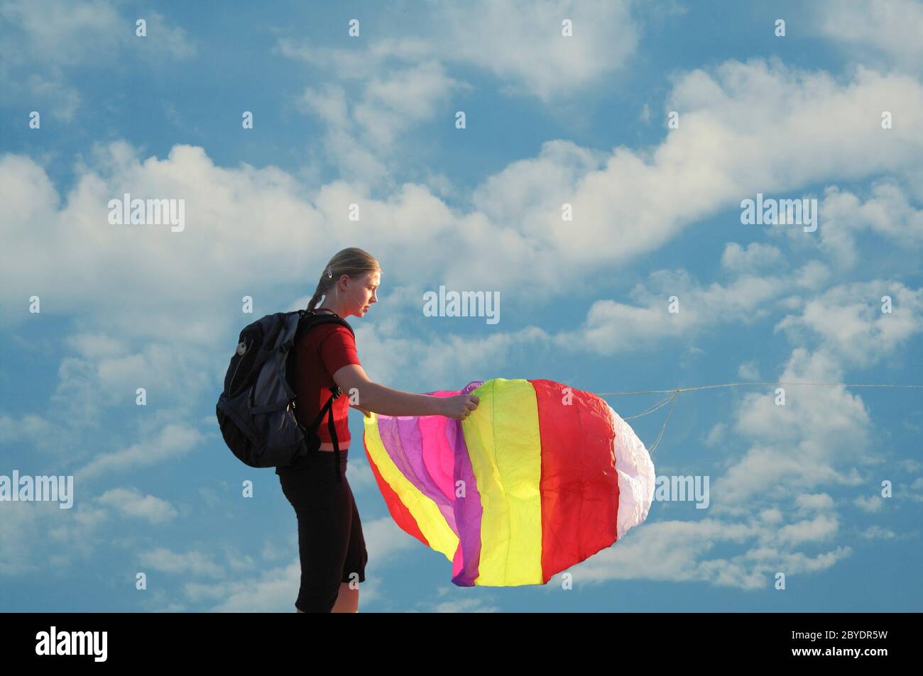 Girl flying a kite Stock Photo - Alamy
