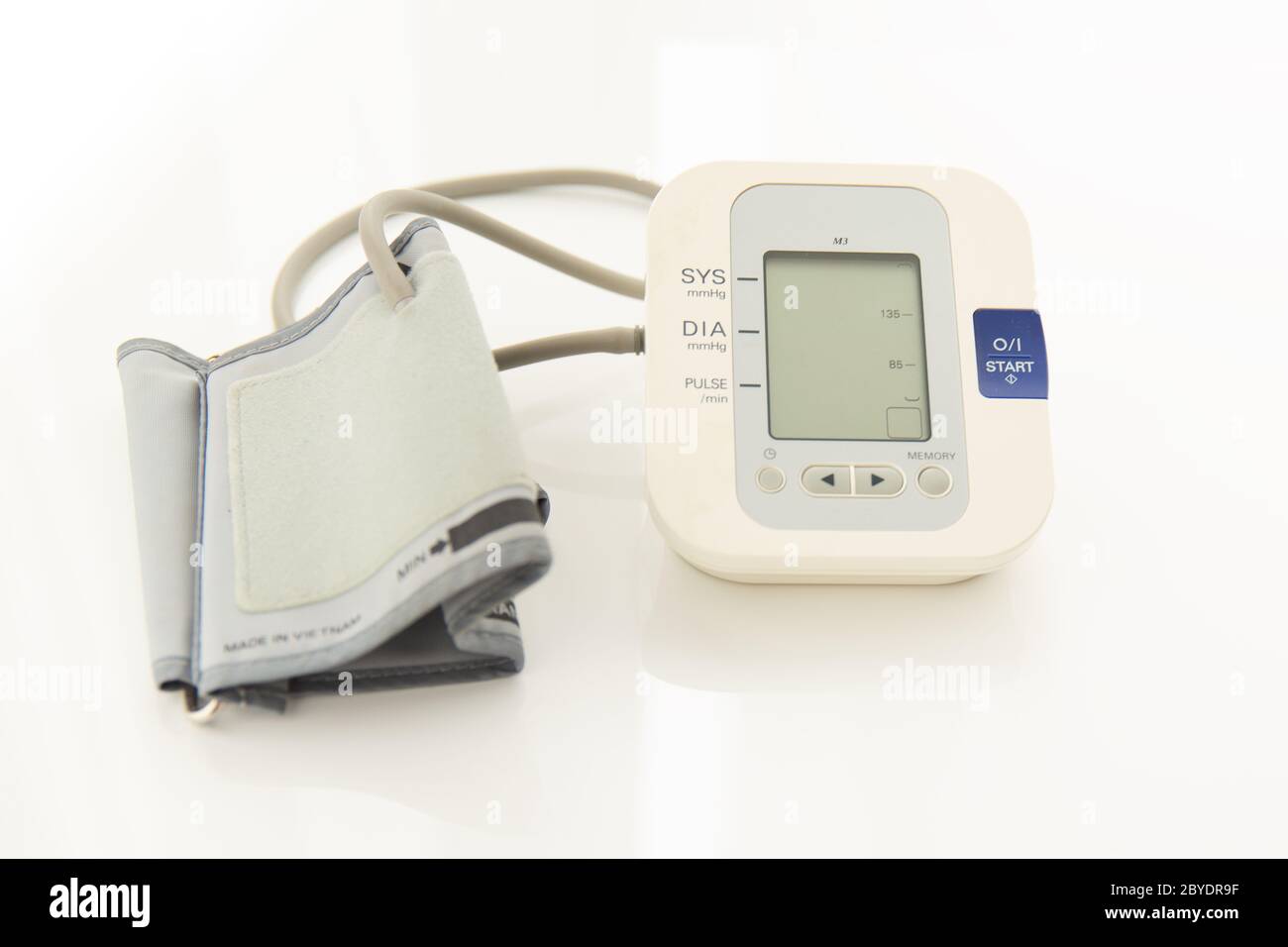 Medical electronic tonometer on white medical table as a background ...