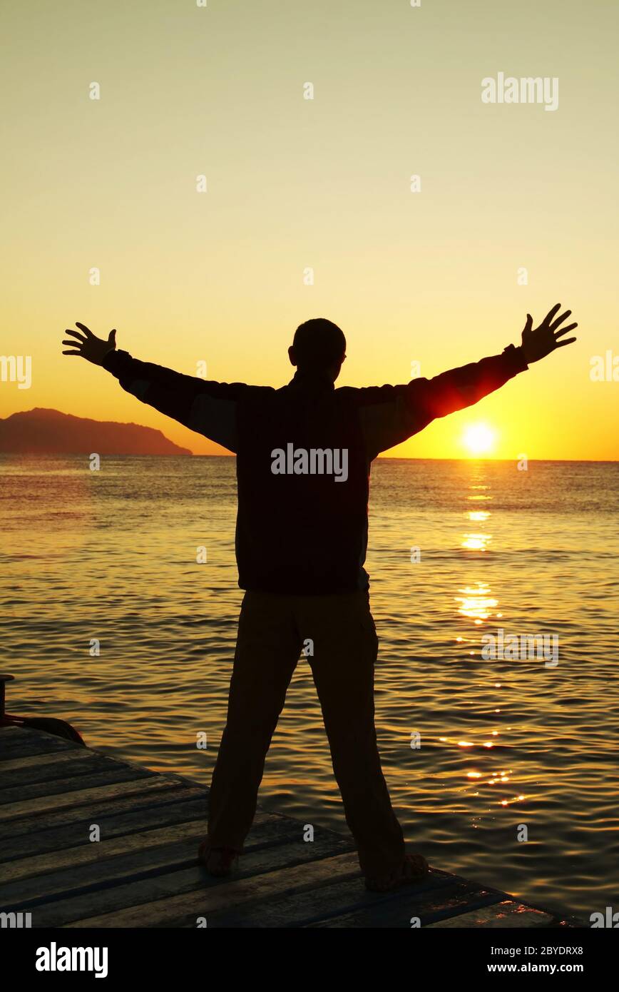 Happiness man on sunset Stock Photo - Alamy