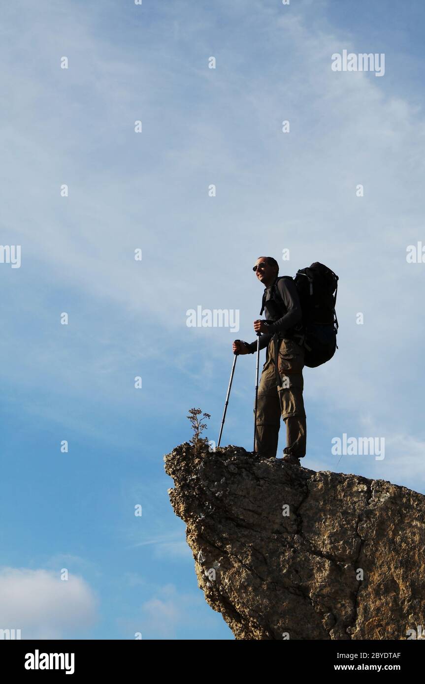 Male on the rock Stock Photo - Alamy