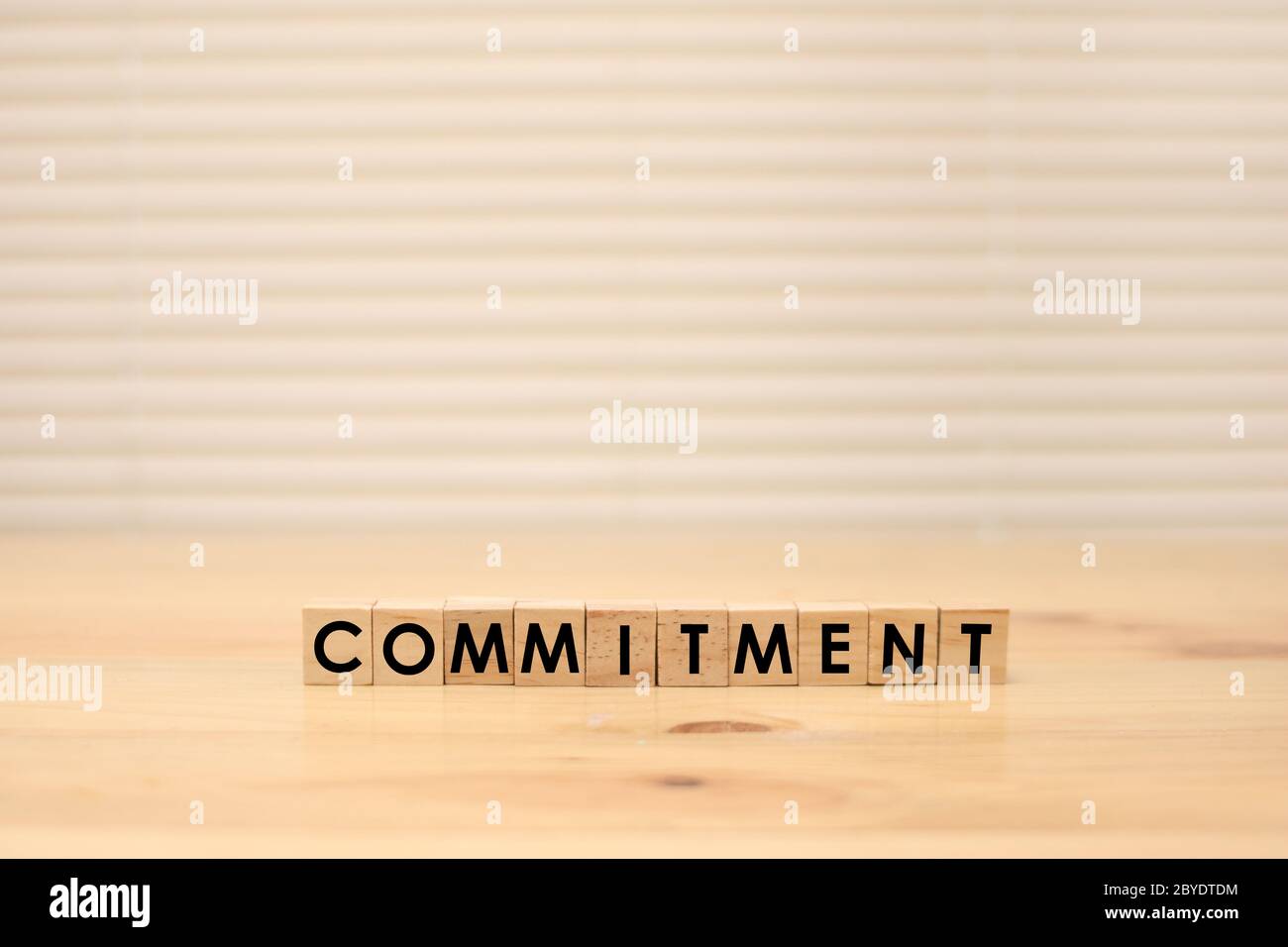 Commitment, word text typography written on wooden alphabet letterpress ...