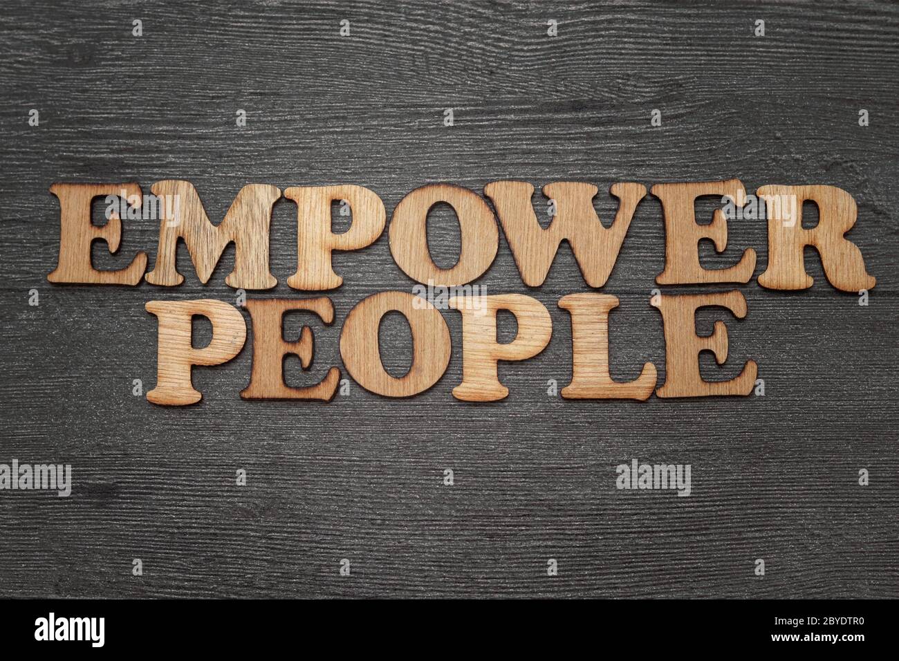 Empower People, word text typography written with vintage wooden ...