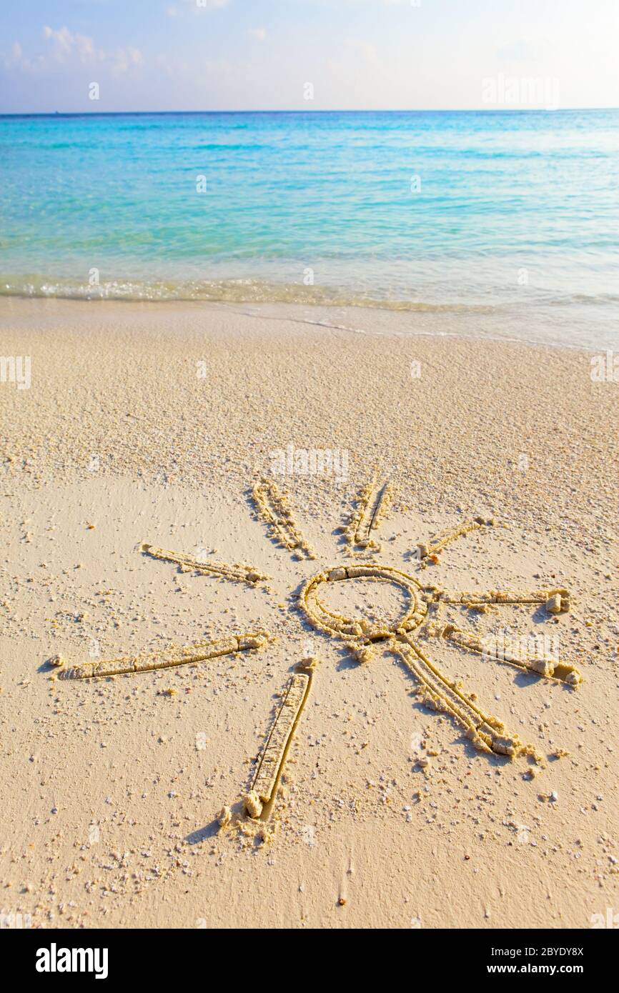The sun - a picture on sand Stock Photo - Alamy