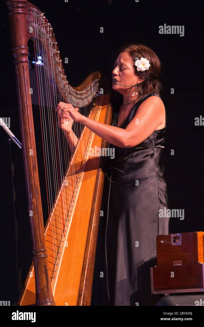 Harpist (model released) in concert Stock Photo - Alamy