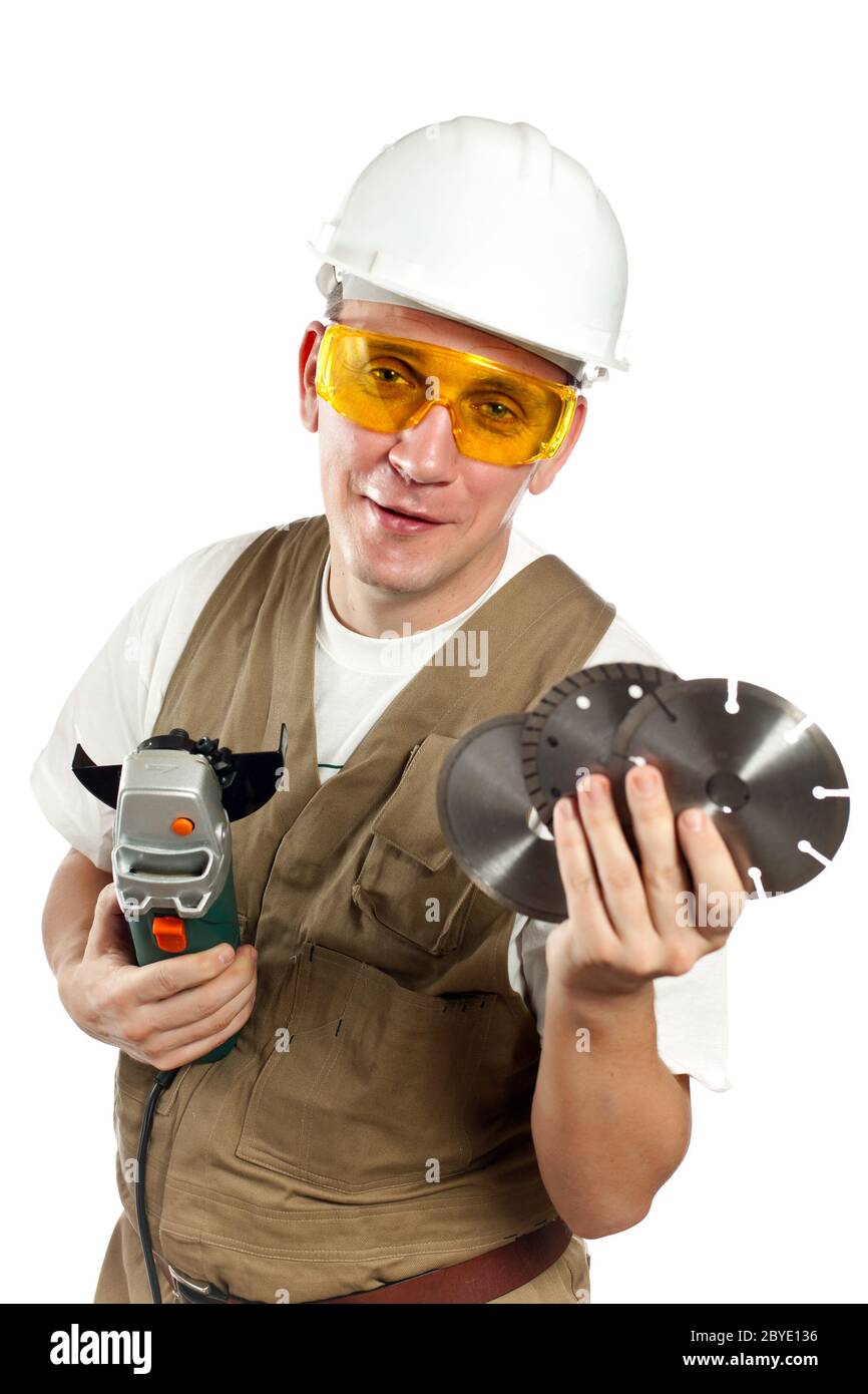 The man, the builder, in goggles and a helmet Stock Photo - Alamy
