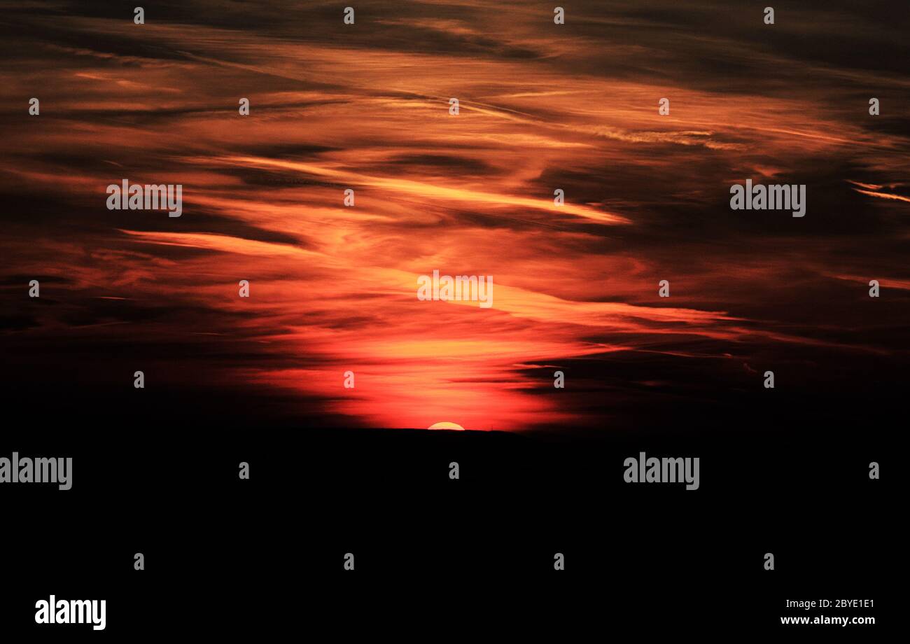 Red sunset sky stormy clouds Stock Photo - Alamy
