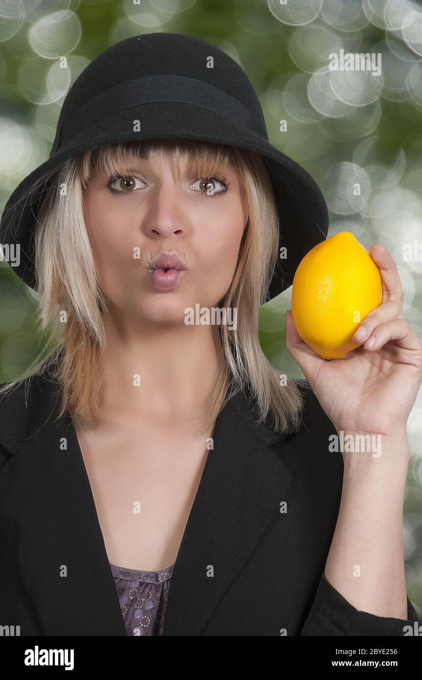 Woman Holding Lemon Stock Photo - Alamy